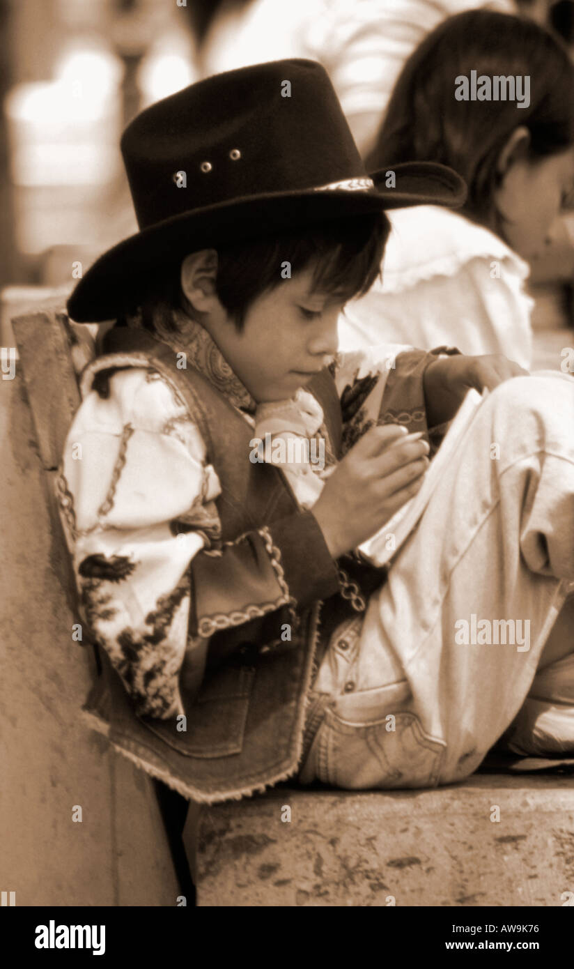 Young mexican cowboy doing his homework Stock Photo - Alamy
