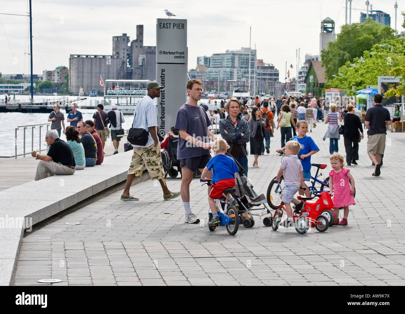 Family with 4 young children at Ontario lakeshore promenade East Pier ...