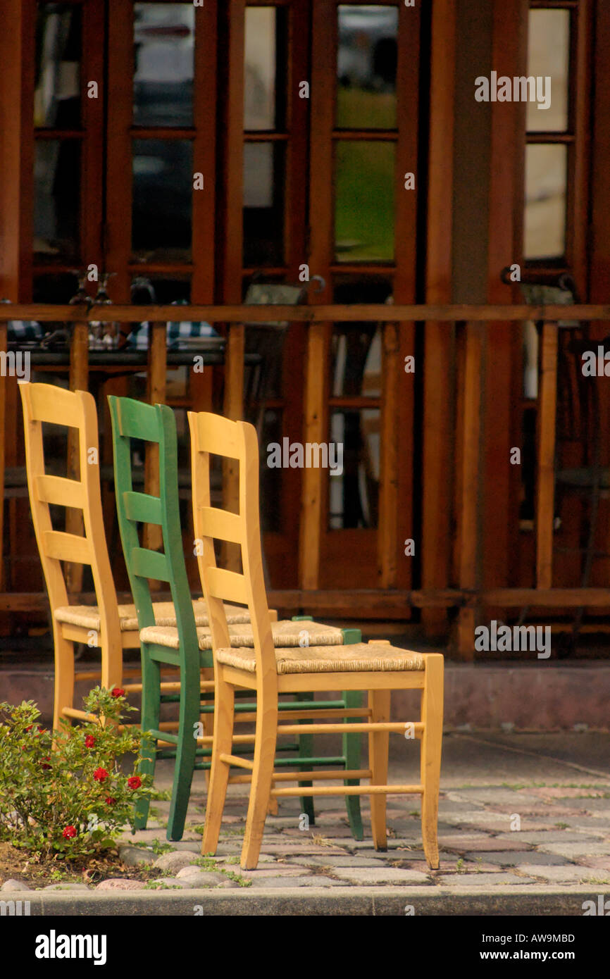 Three colorful chairs lined up in front of a restaurant in Encinitas ...