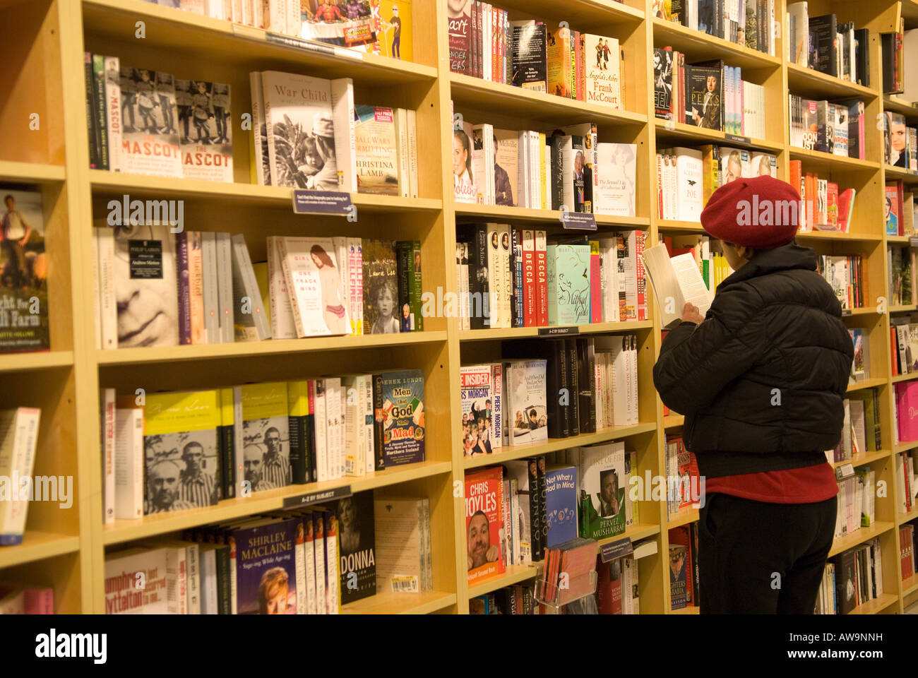 Woman perusing Biography section in Borders Bookshop Kingston Surrey ...