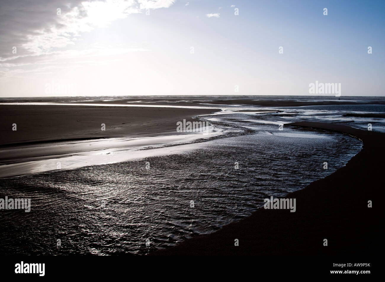 An image of a sunset over the beach infront of the prominade in ...