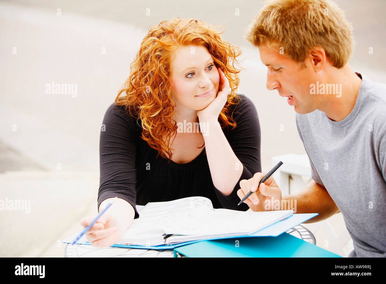 Man and woman studying together Stock Photo - Alamy