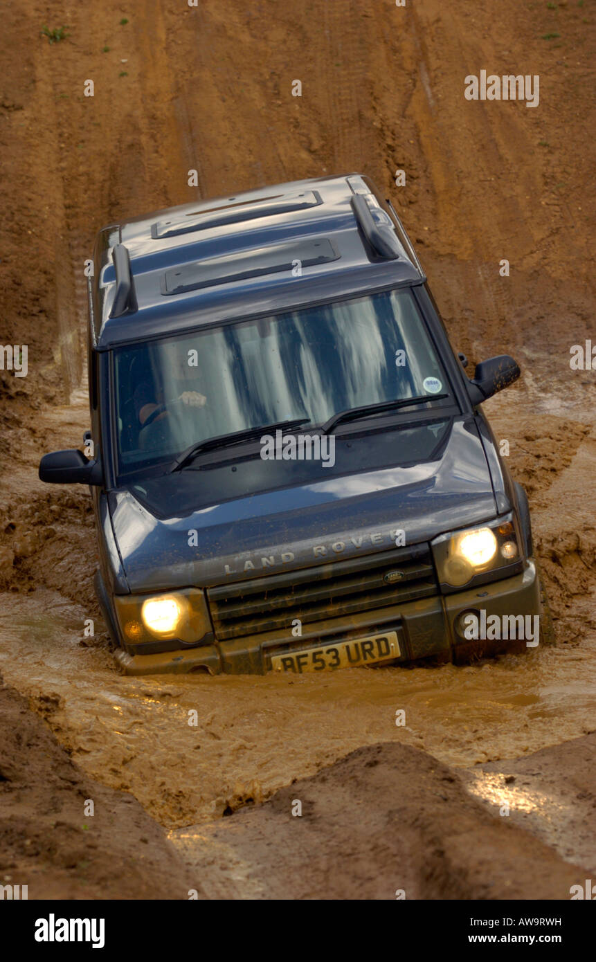 Land rover defender negotiating water hi-res stock photography and ...