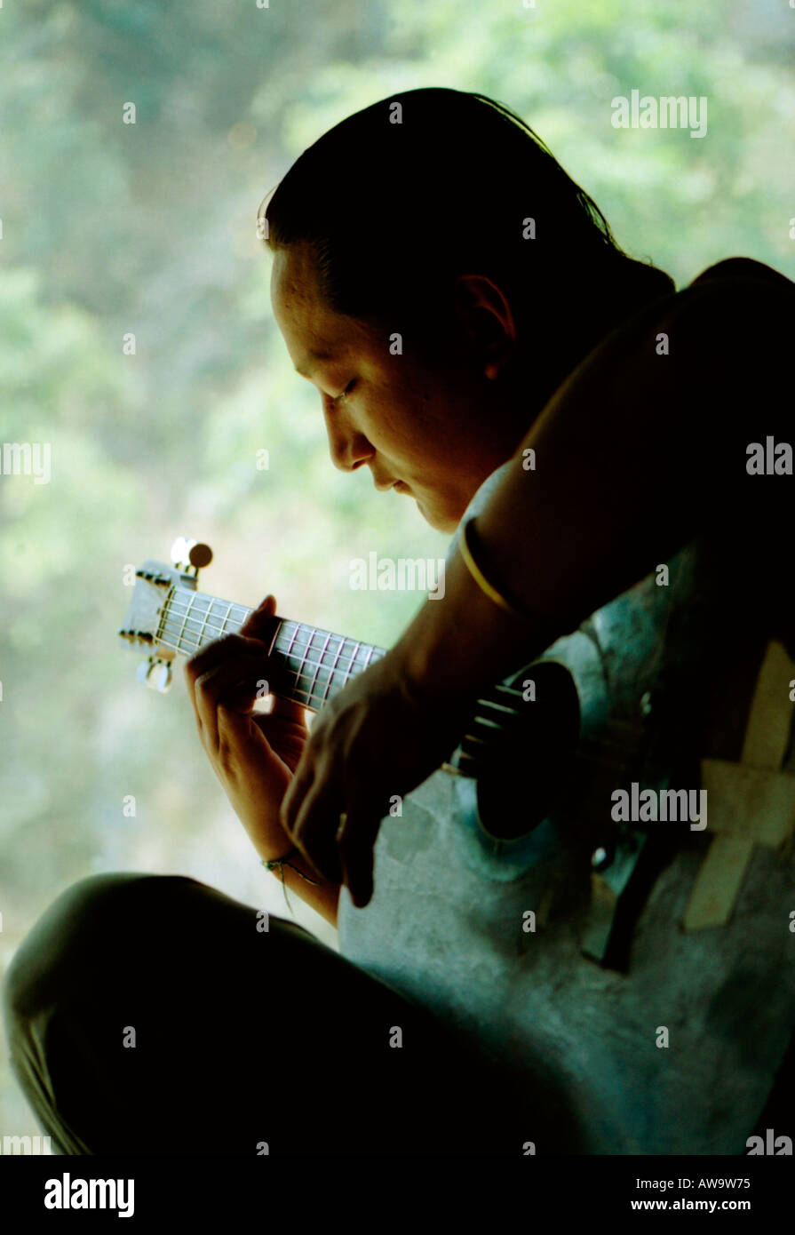 Young nepali guitar player Stock Photo - Alamy