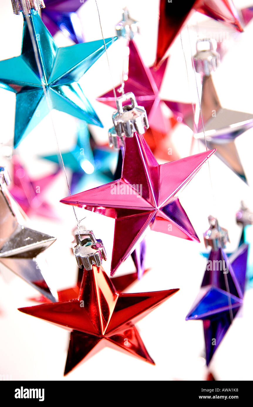Coloured Christmas star decorations on a white background Stock Photo ...