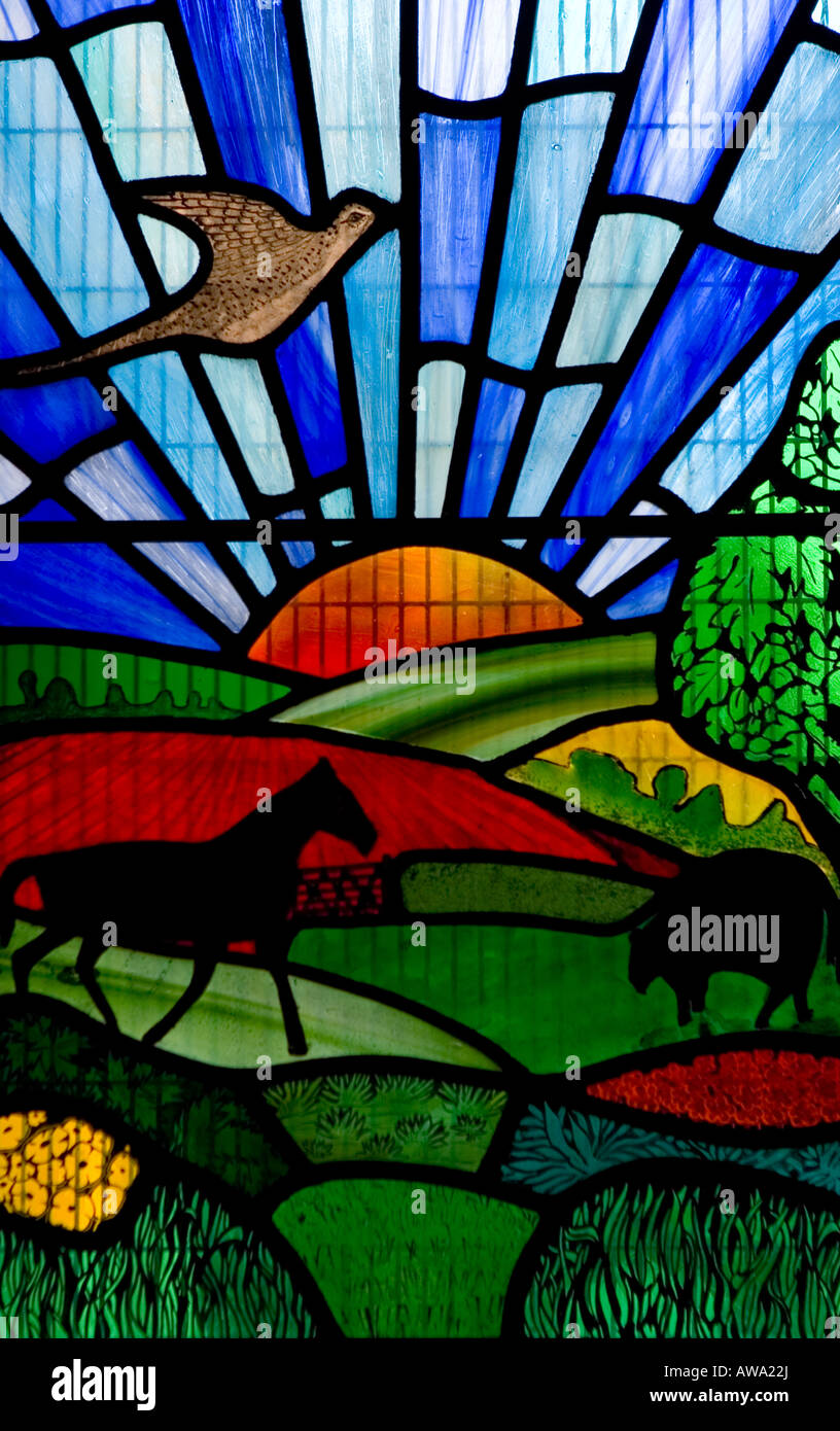 Stained glass window depicting the sun rising in the county Stock Photo ...
