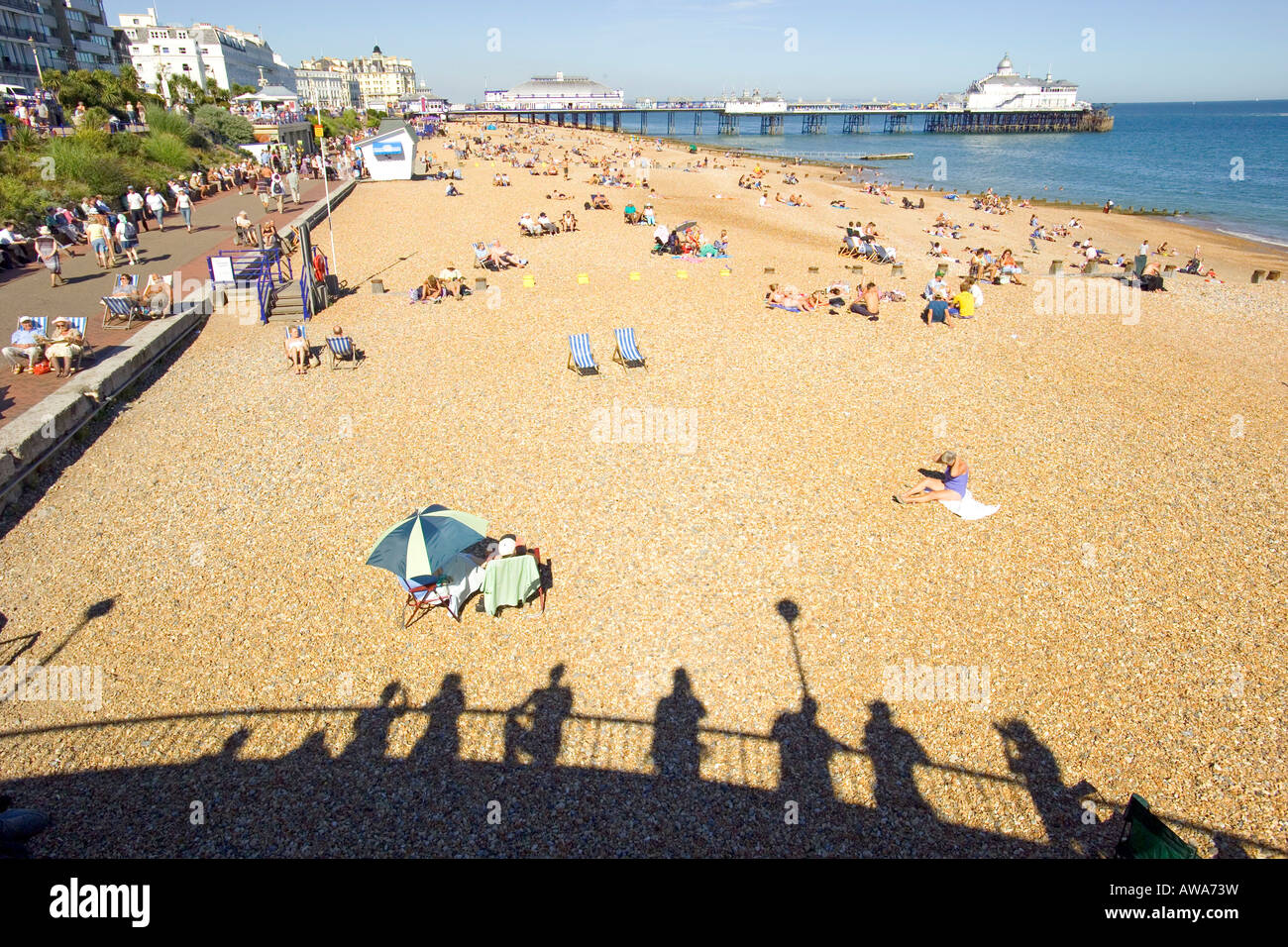 Wide angle view of a typical English beach scene in summer with blue ...