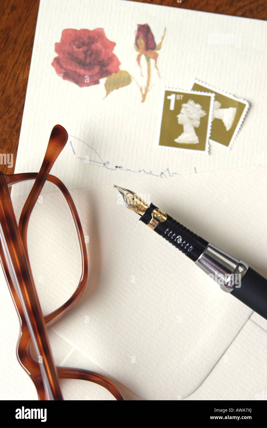personal letter with ink pen glasses and stamps Stock Photo - Alamy