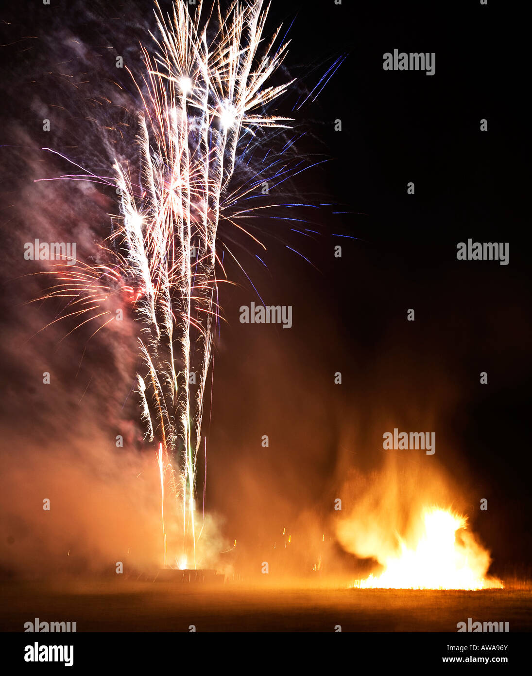 Fireworks next to a bonfire Stock Photo - Alamy