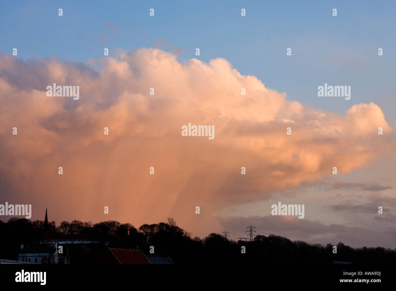 Rain storm in late afternoon sunshine in North Yorkshire in the British ...