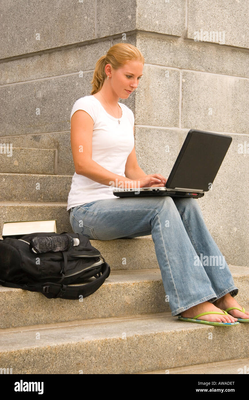 Young blonde female college student studying on campus Stock Photo - Alamy