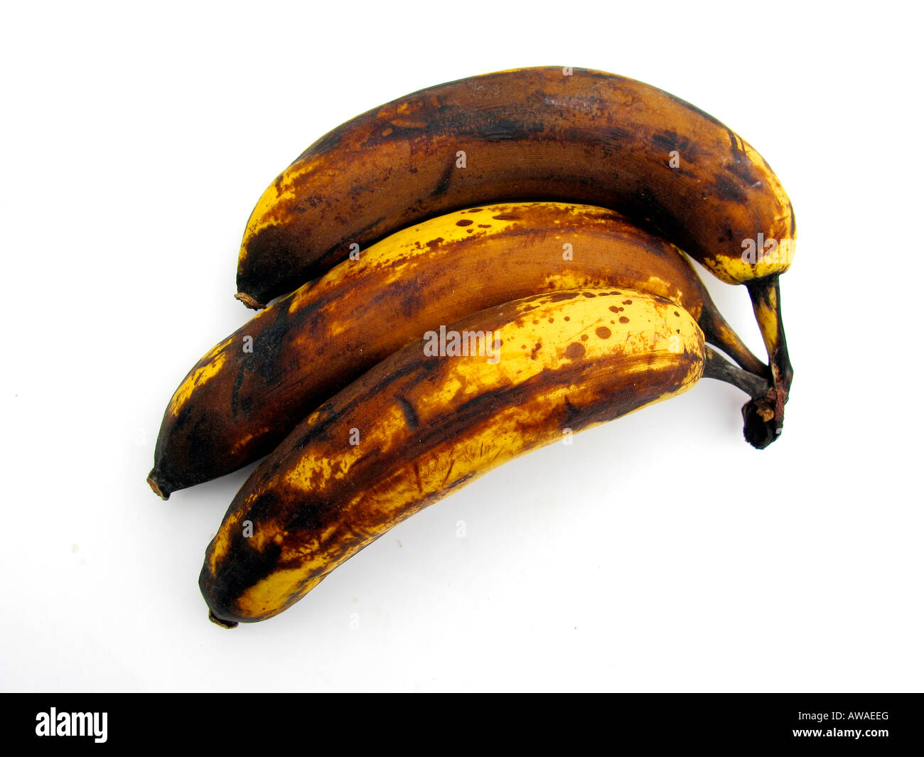 Over ripe bananas on a white background Stock Photo - Alamy