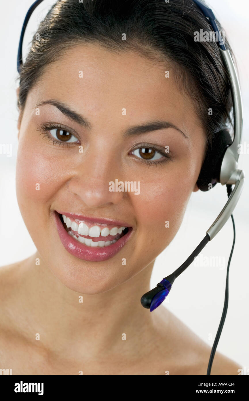 Woman using a headset Stock Photo - Alamy