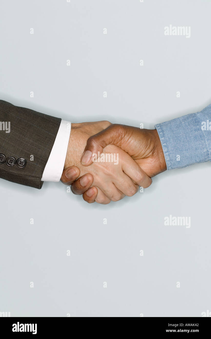 Two men shaking hands hi-res stock photography and images - Alamy