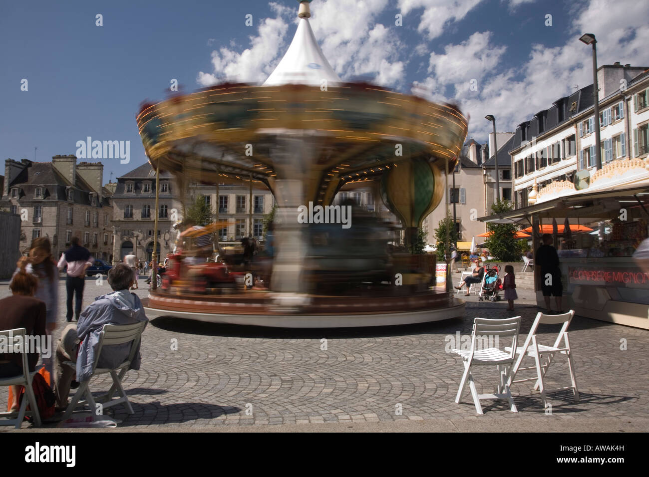 Carousel turning in the market square Quimper Brittany France Stock ...