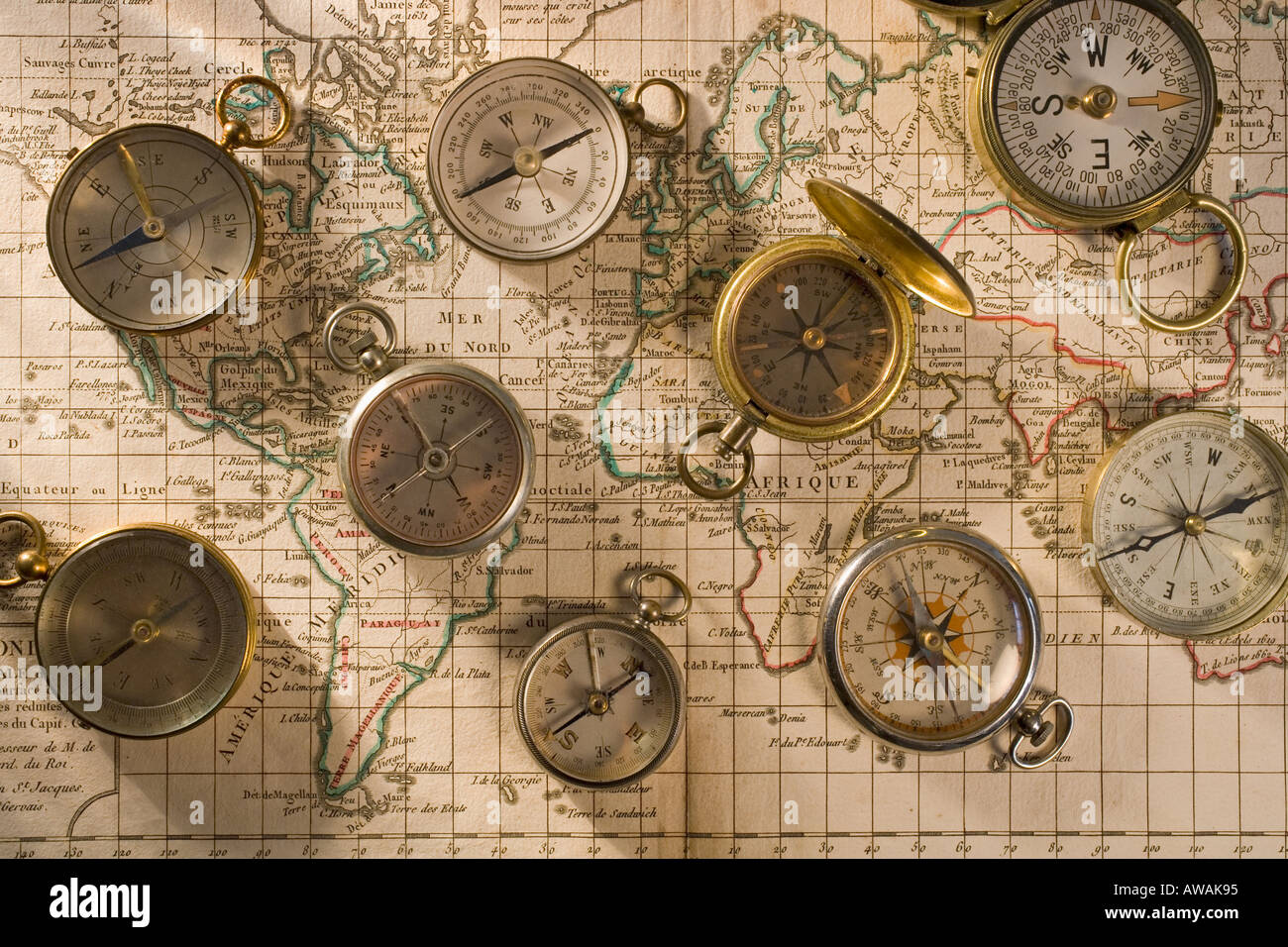 Compasses on a map Stock Photo - Alamy
