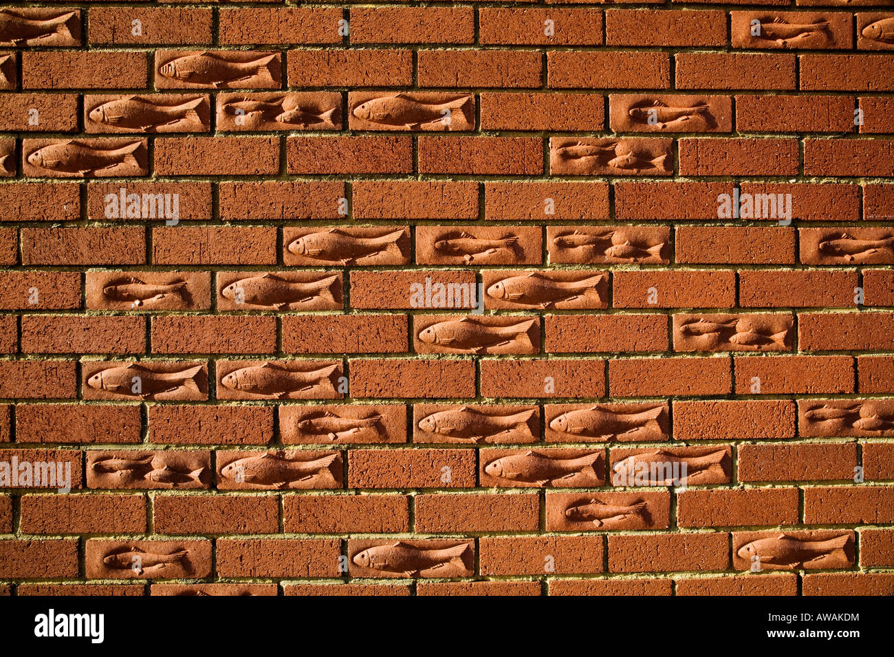 Brick wall with a fish motif hi-res stock photography and images - Alamy