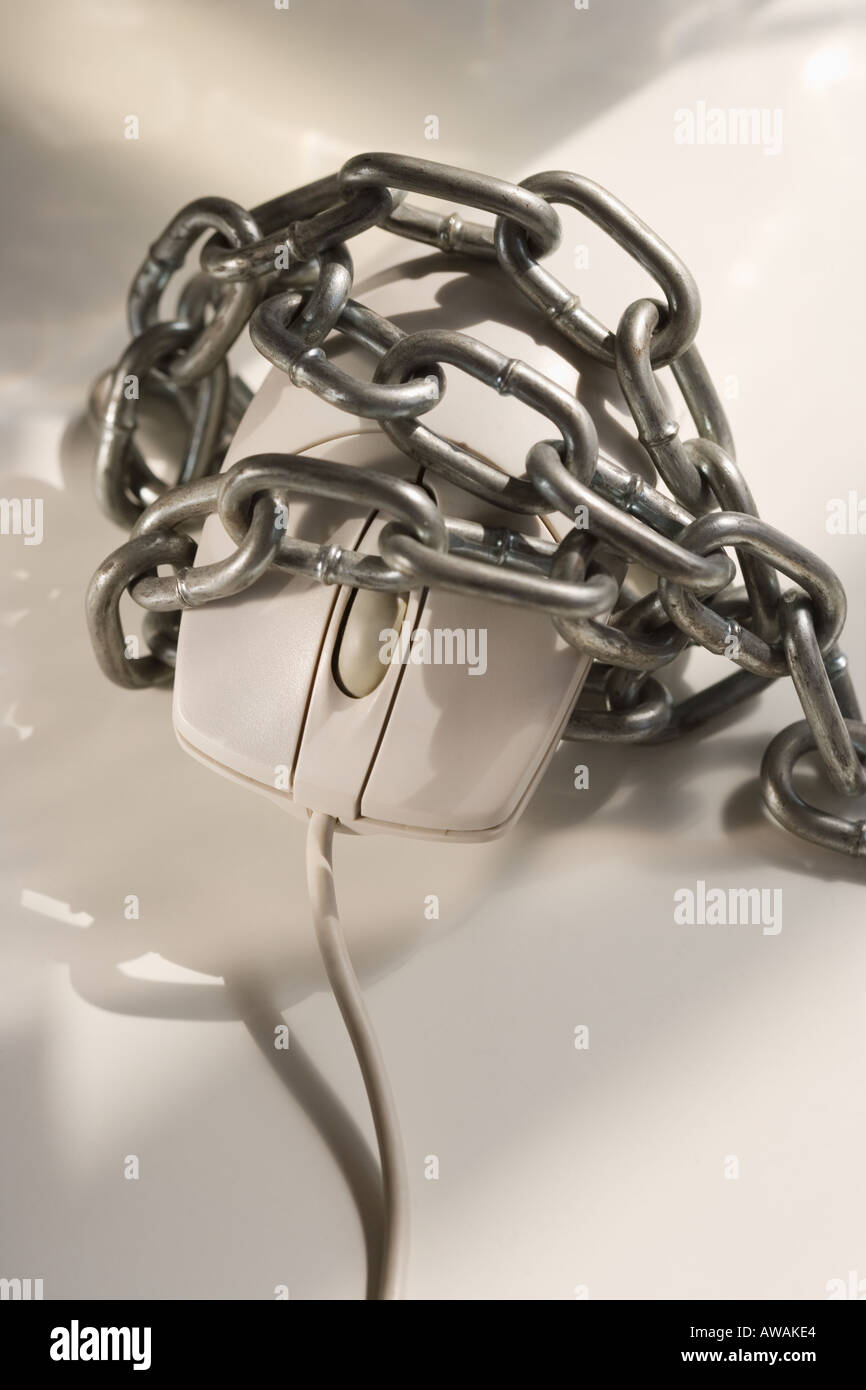 Closeup of computer mouse covered in chains Stock Photo - Alamy