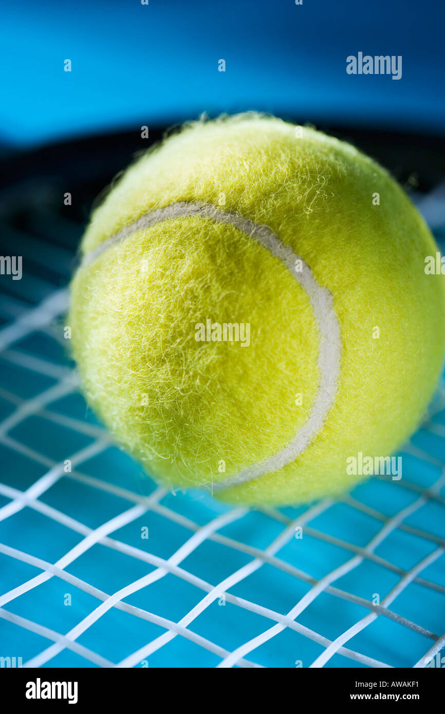 Closeup of tennis racquet and ball Stock Photo - Alamy