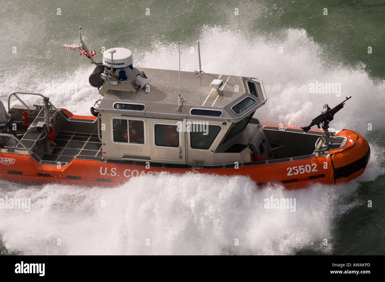 A U.S. Coastguard patrol boat running through heavy seas in September ...