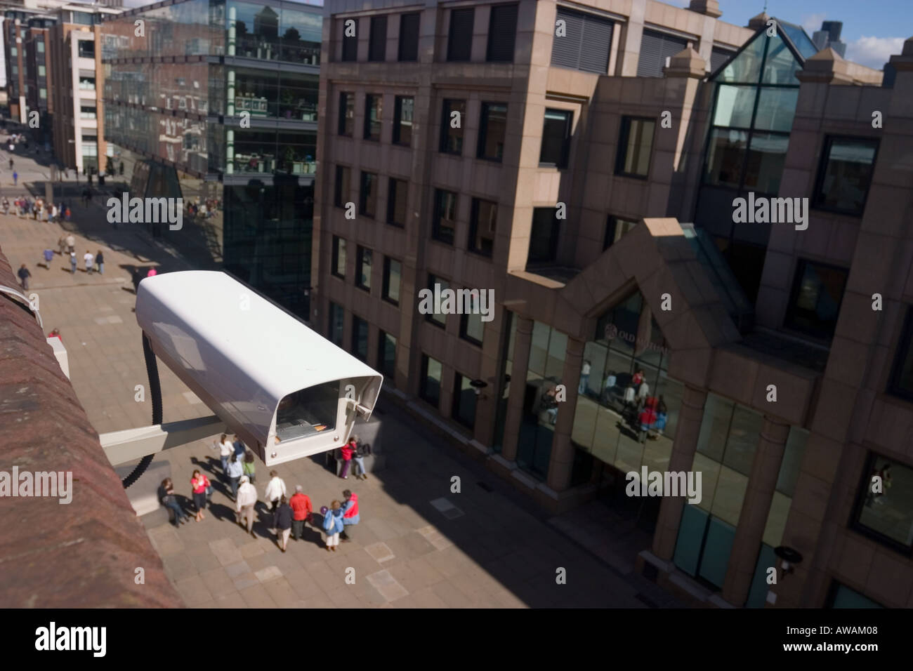 CCTV security camera on rooftop watches over pedestrianized area in ...