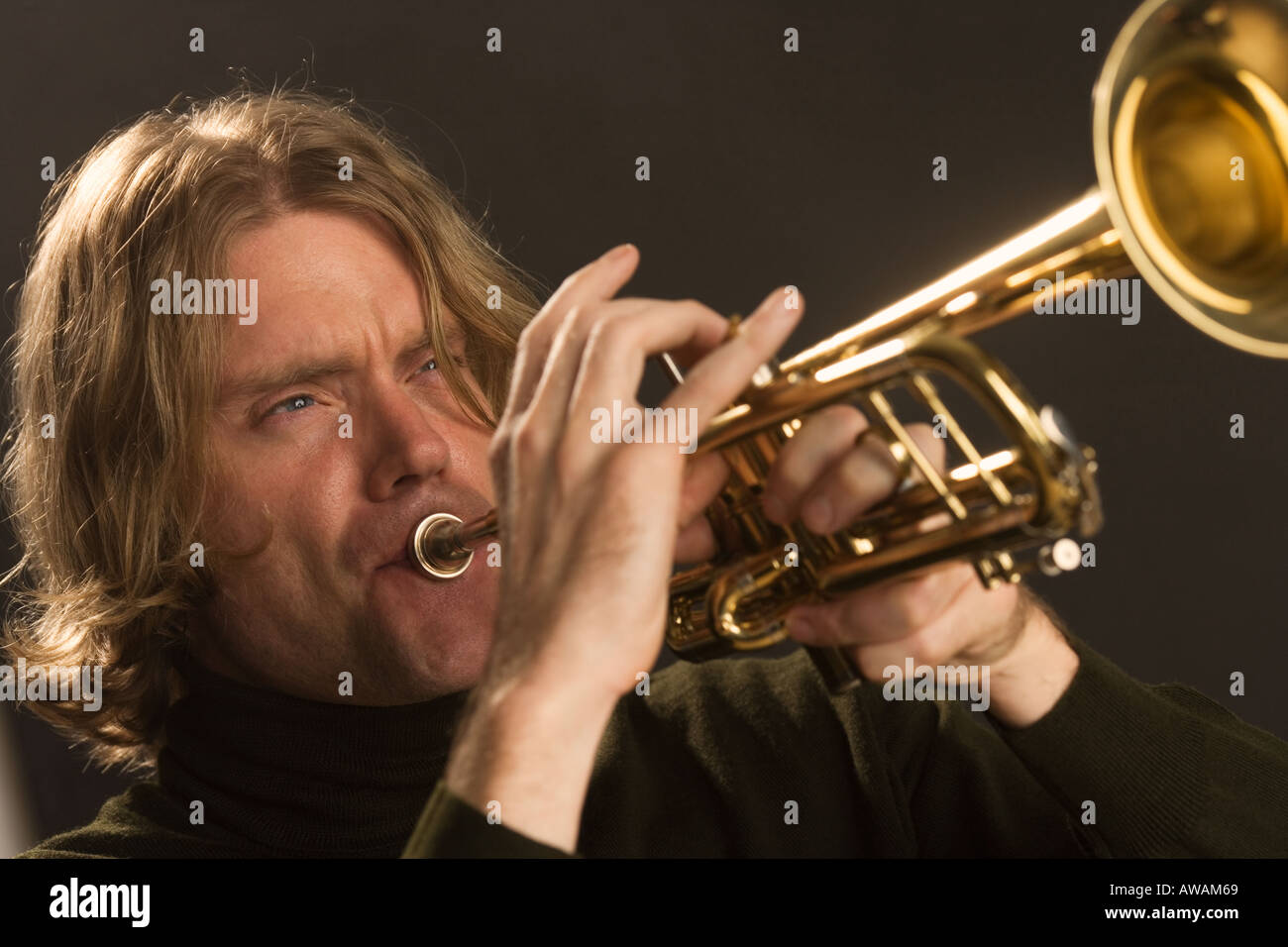 Man blowing trumpet hi-res stock photography and images - Alamy