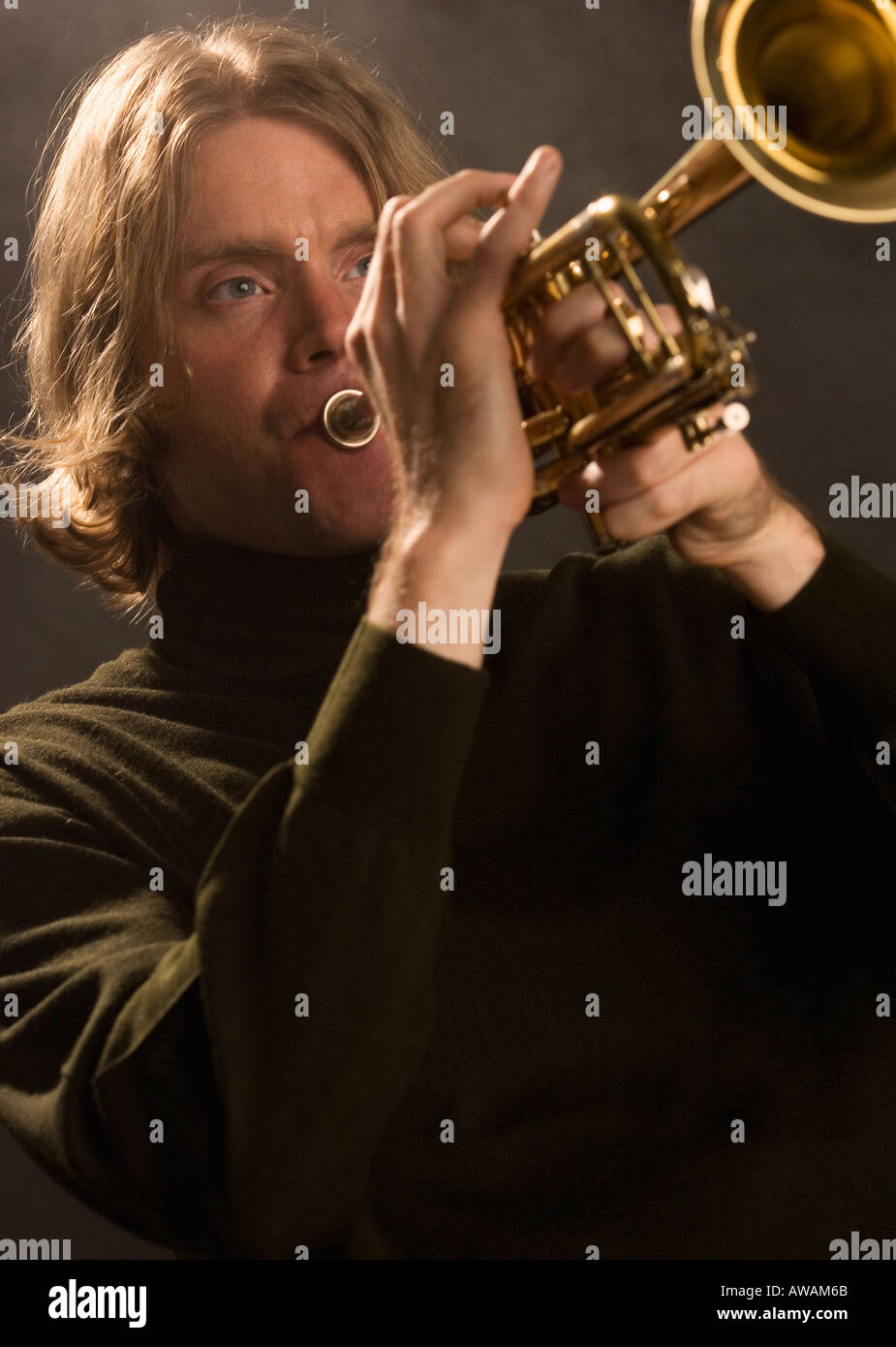 Man blowing trumpet hi-res stock photography and images - Alamy