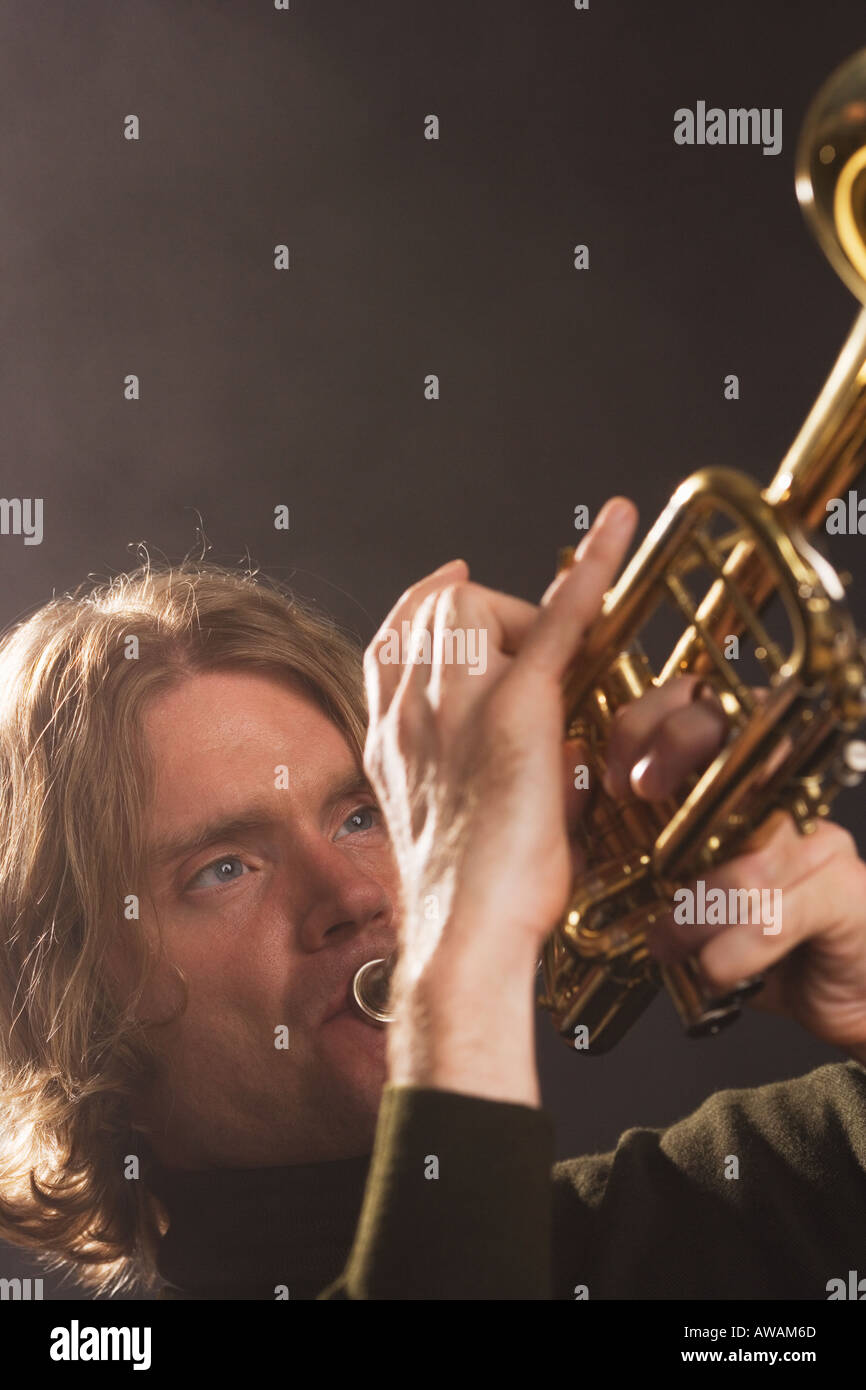 Man playing horn Stock Photo - Alamy