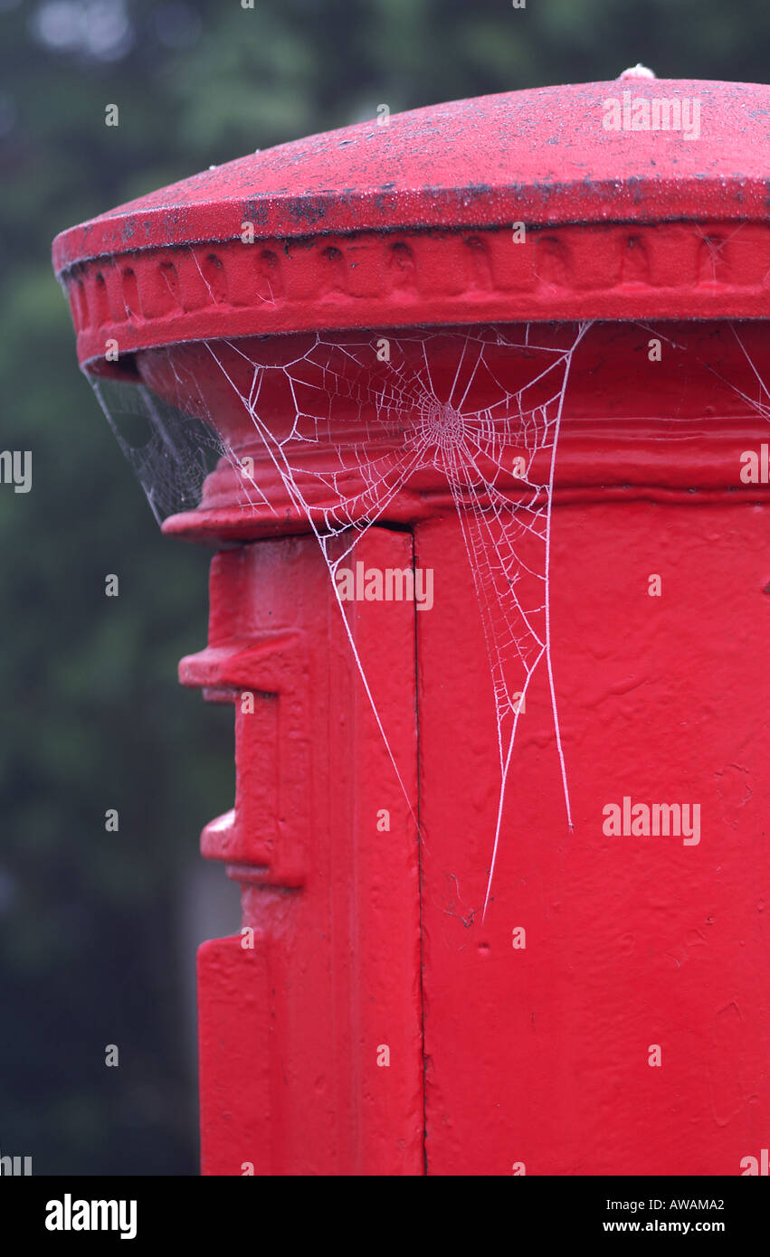 Red letter box and spider web Stock Photo - Alamy