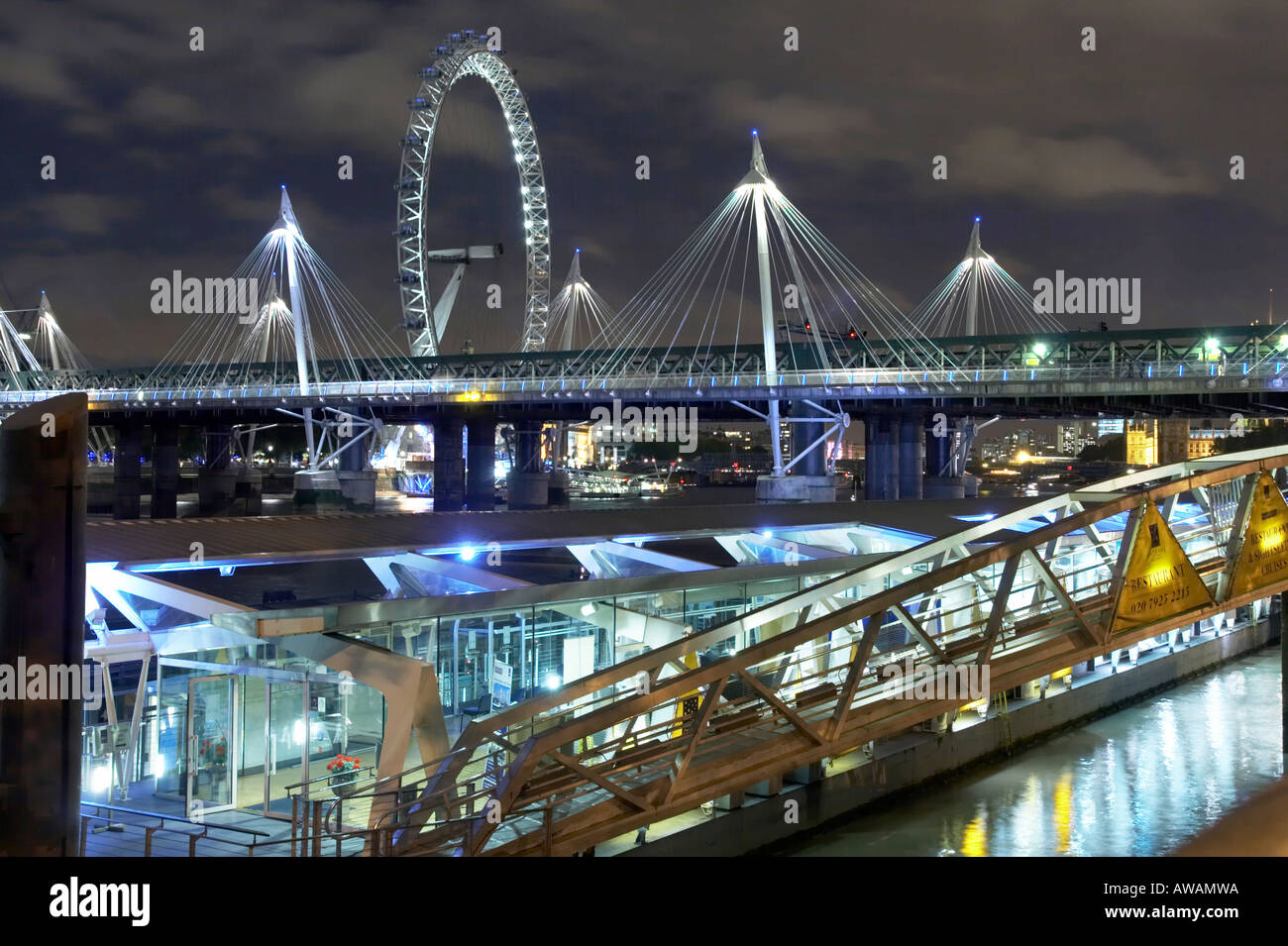 London night view of the Ferry pier on the River Thames and Jubilee ...