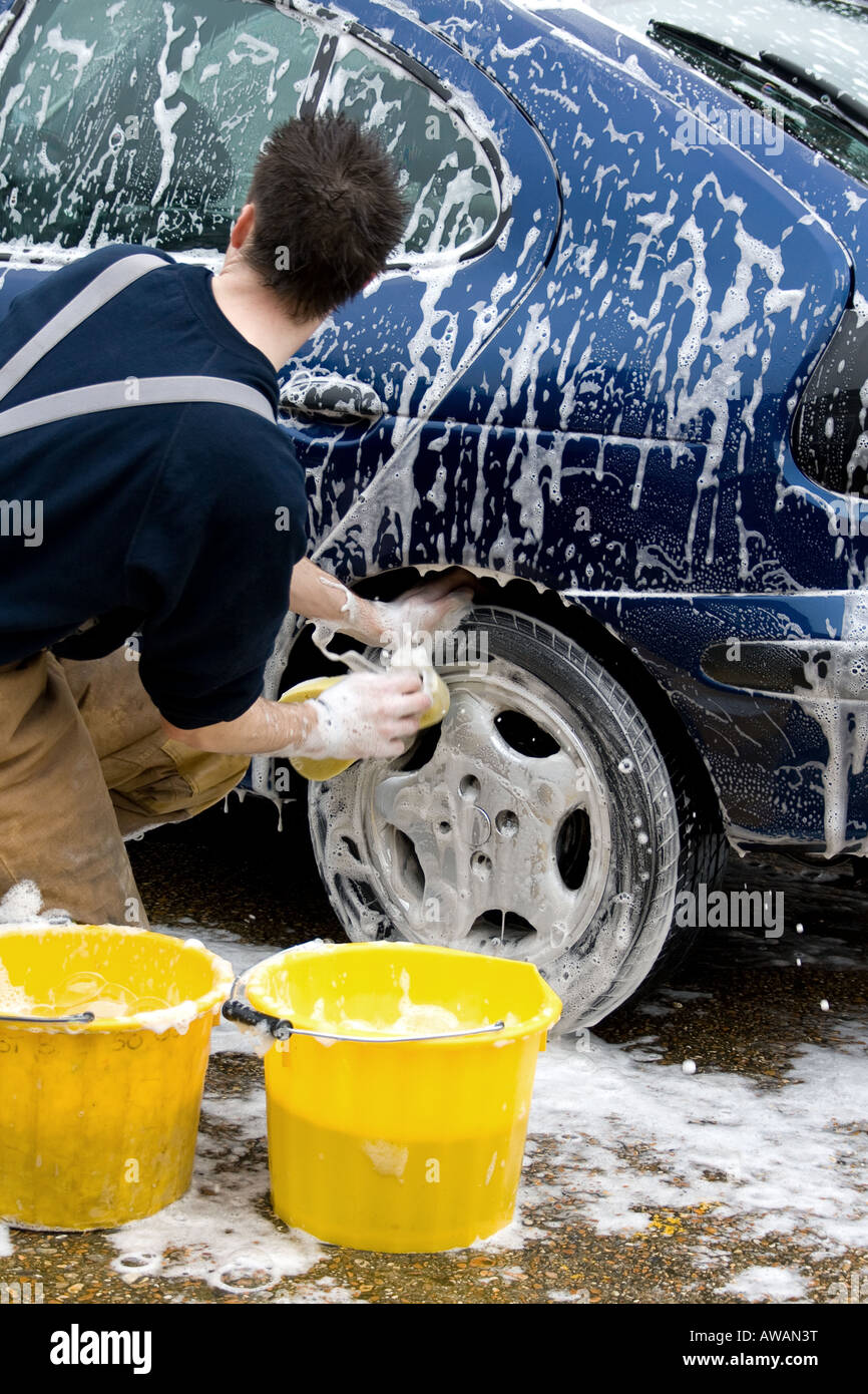 fireman washing car for charity, sussex england uk Stock Photo - Alamy