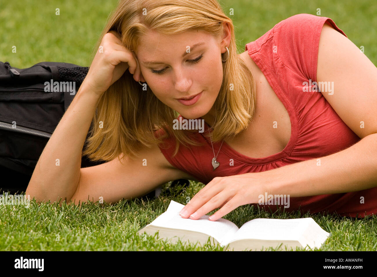 Young blonde female college student studying on campus Stock Photo - Alamy