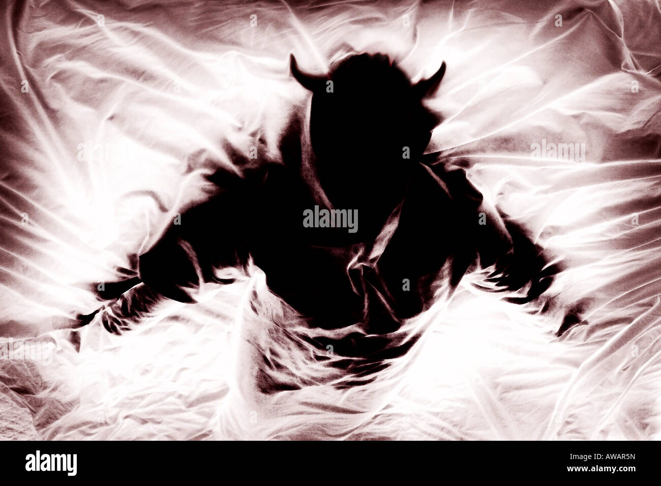 Silhouette of figure representing evil Stock Photo - Alamy