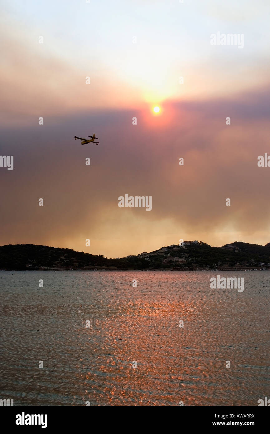 Plane flying over Anavissos, Greece Stock Photo - Alamy