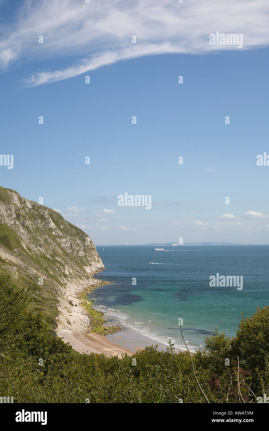 The chalk escarpment of Ballard Down plunges into the English Channel ...