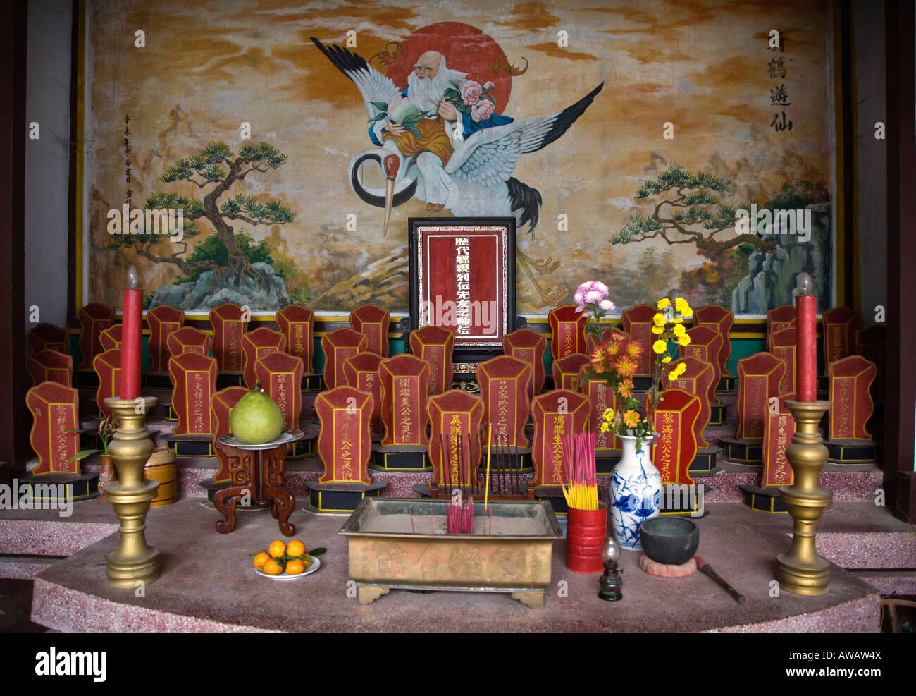 Small memorials line an altar inside the ASSEMBLY HALL OF THE CANTONESE ...