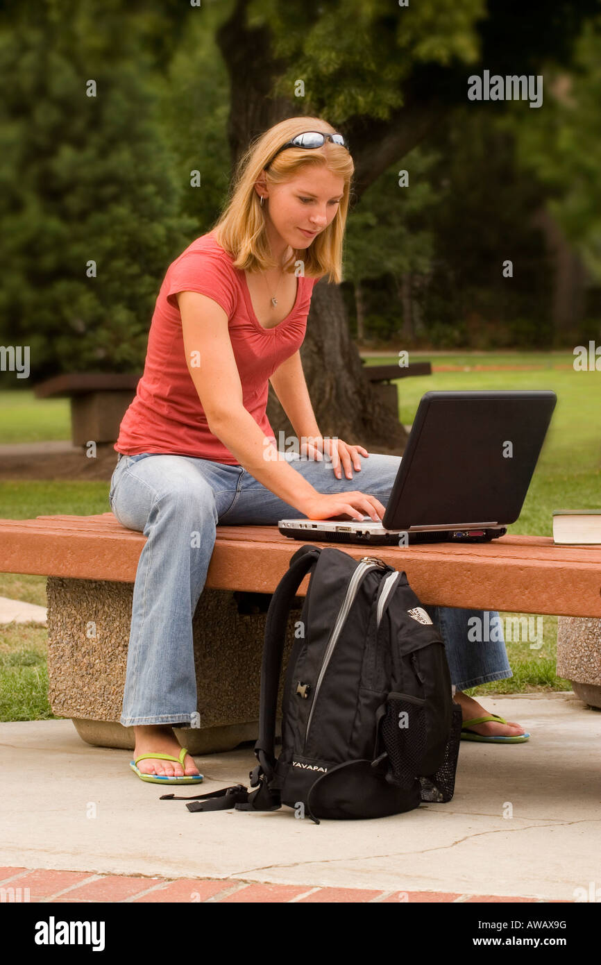 Young blonde female college student studying on campus Stock Photo - Alamy