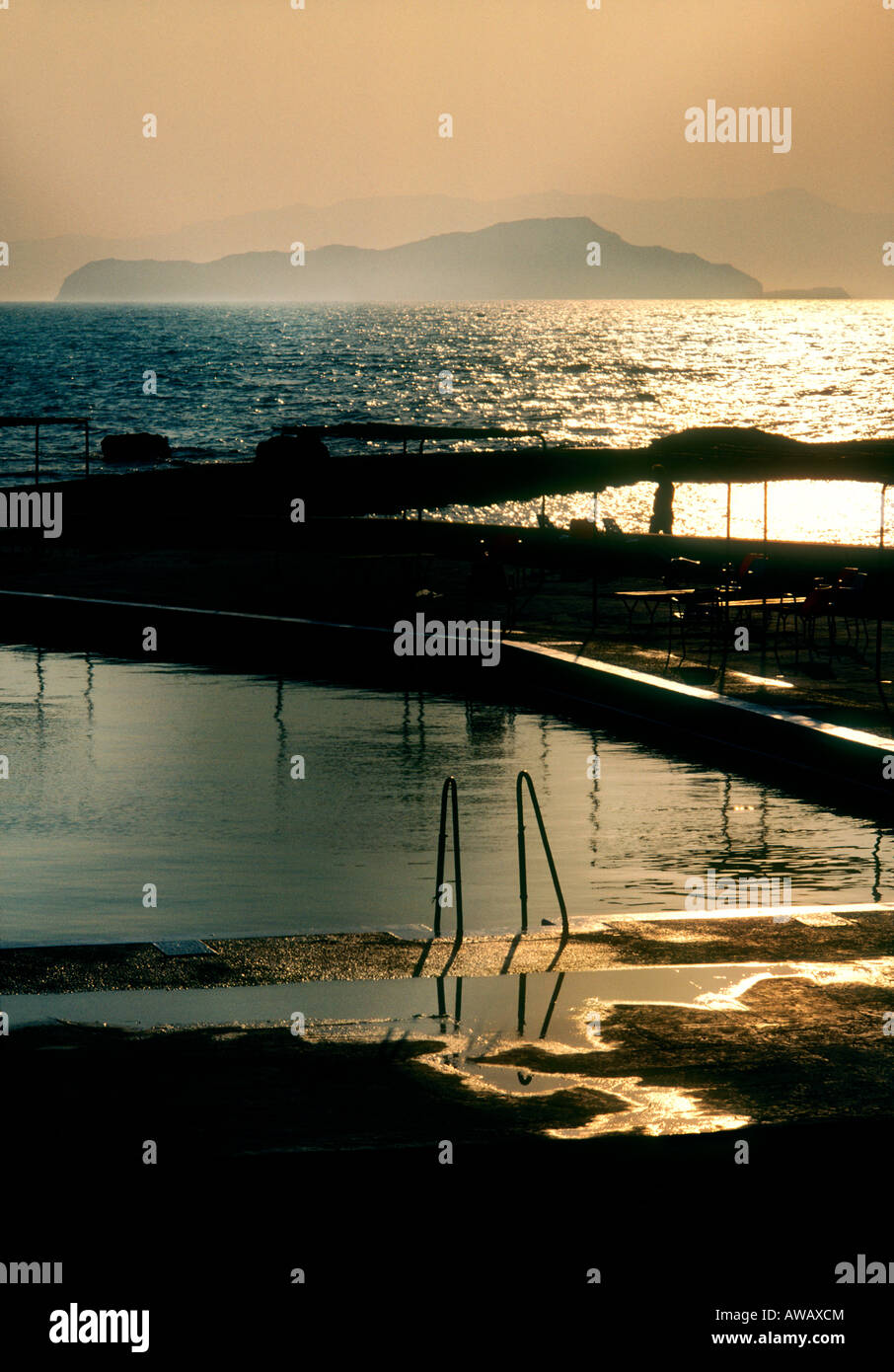 Swimming pool on edge of Chania waterfront looking out to sea, Crete at ...