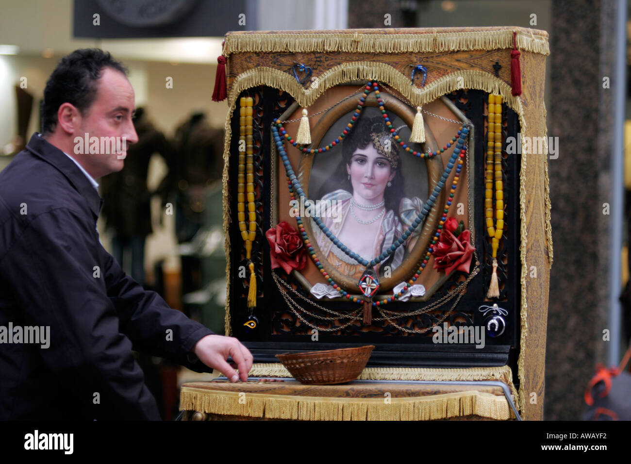 Greece Attica Athens a street peformer with old fashioned music box ...