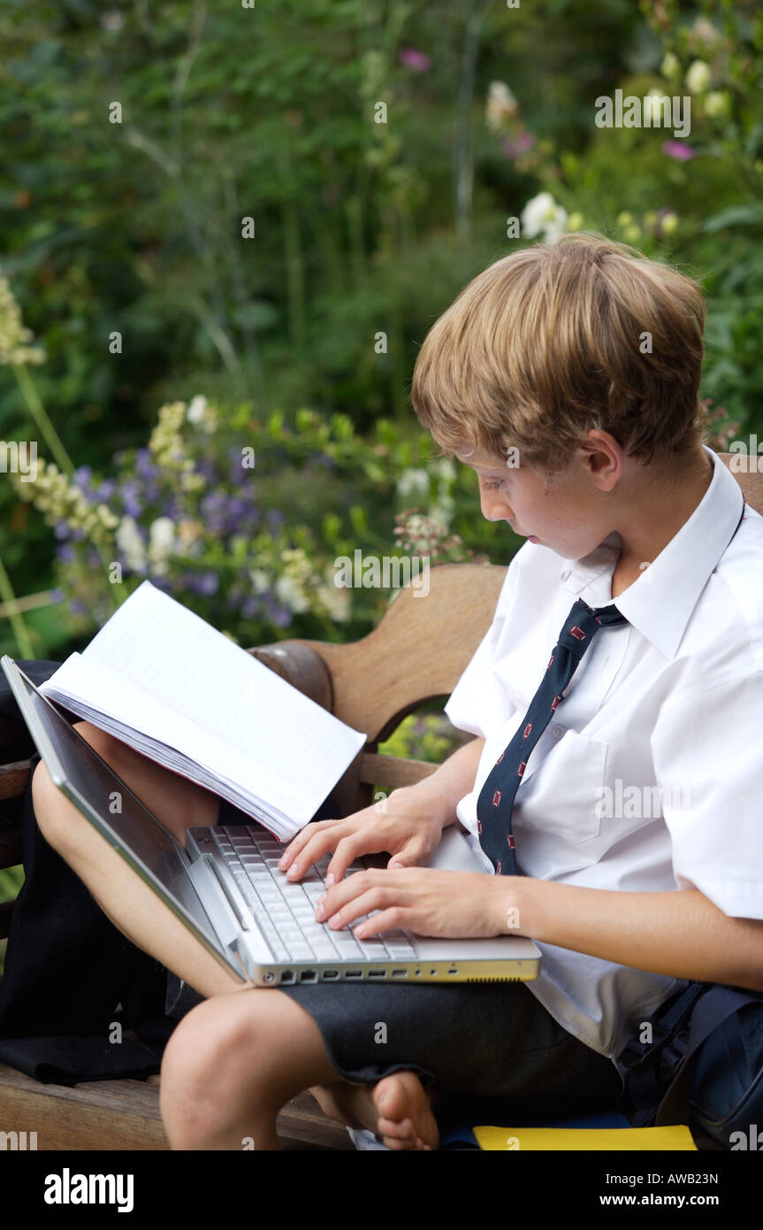 Schoolboy doing homework on a laptop Stock Photo - Alamy