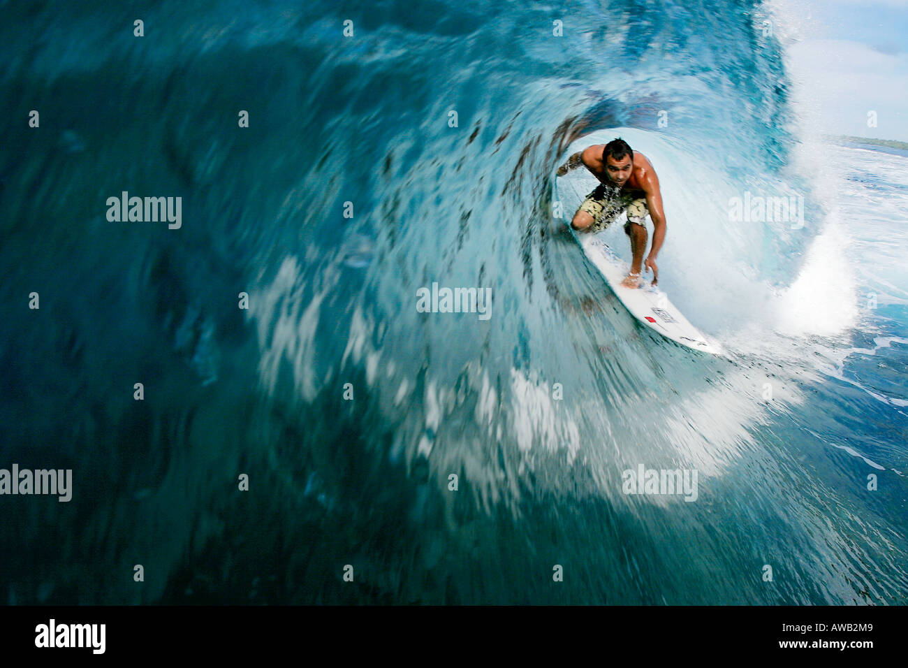 surfer in a barrel in south pacific Stock Photo - Alamy