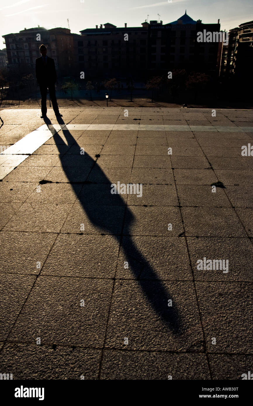 Long man shadow in urban background Stock Photo - Alamy