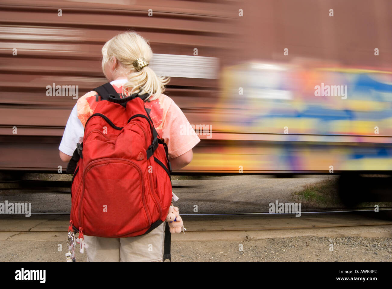 Child running in front of car hi-res stock photography and images - Alamy