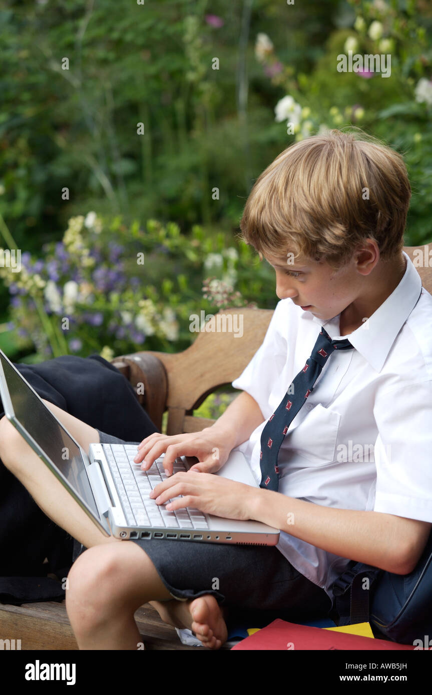 Schoolboy doing homework on a laptop Stock Photo - Alamy