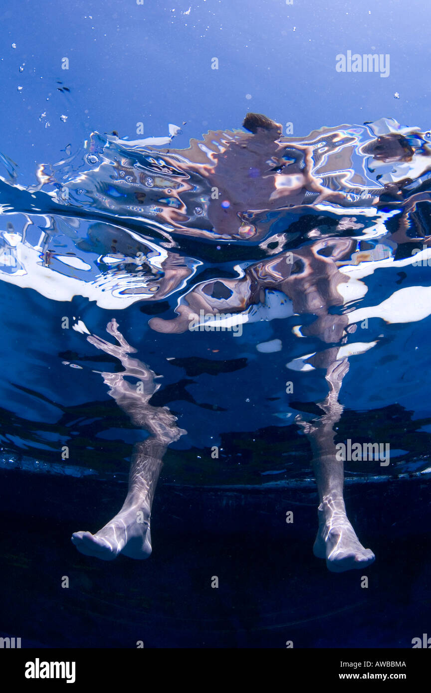 Man dangling feet over water hi-res stock photography and images - Alamy