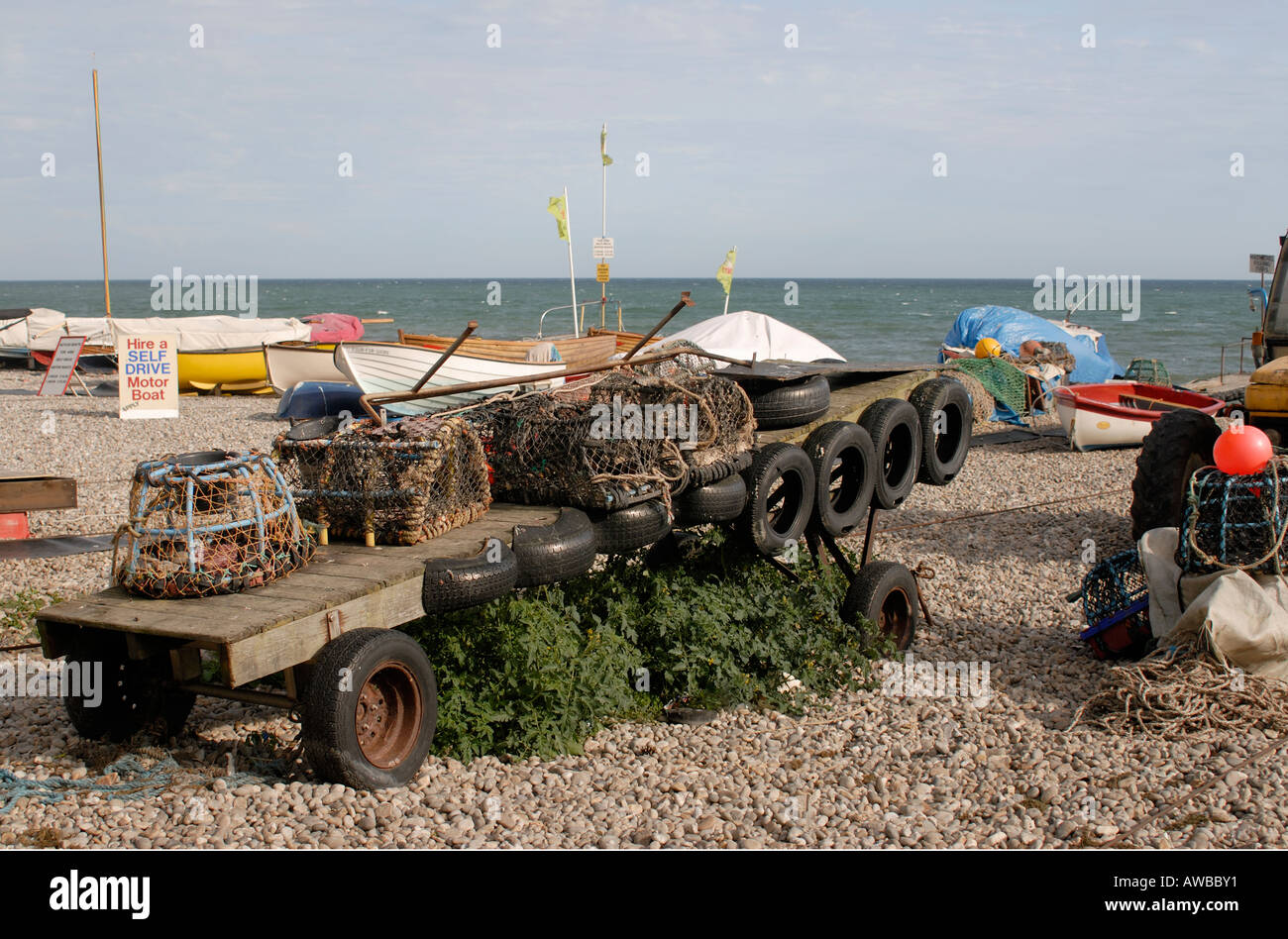 An old moveable jetty loaded with crab and lobster pots on the beach ...