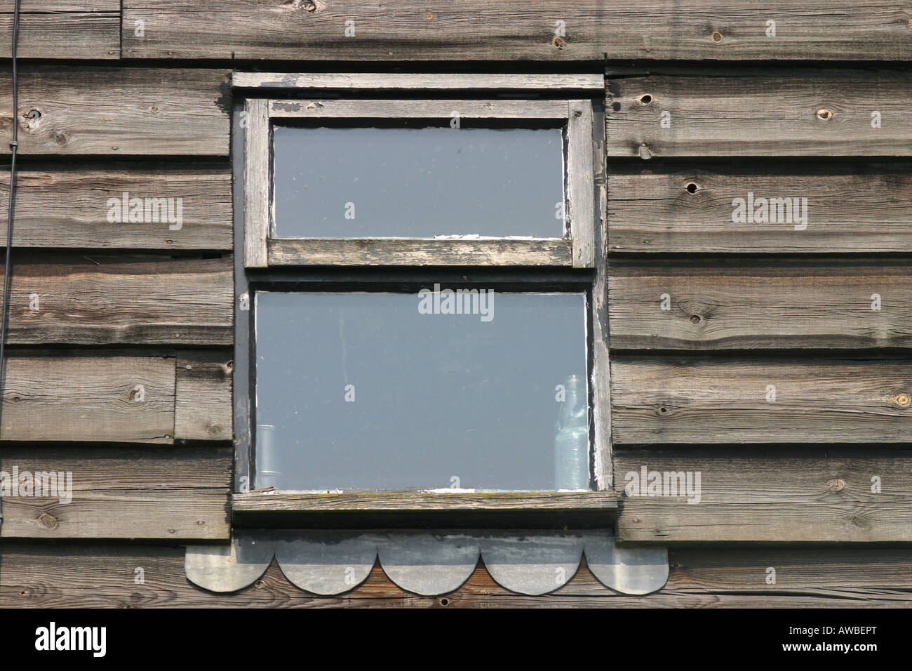 old wooden wall slats barn twin glass windows Stock Photo - Alamy
