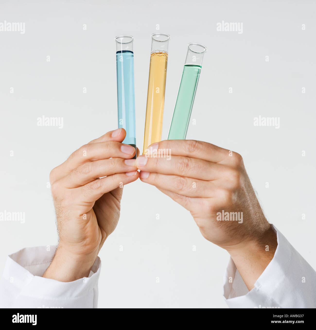 Hand holding test tubes Stock Photo - Alamy