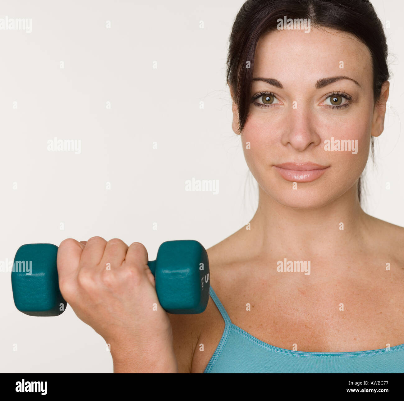 Woman lifting weights Stock Photo - Alamy