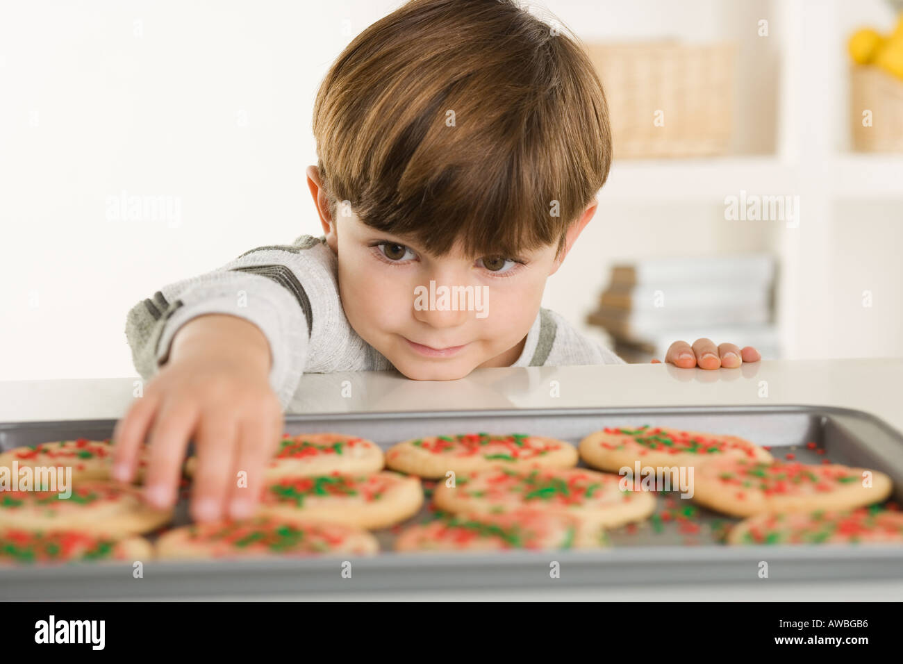 Kid reaching for cookie hi-res stock photography and images - Alamy
